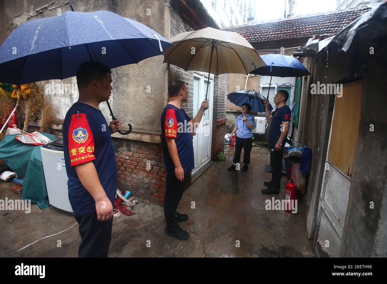 JINAN, CHINA - JULY 29, 2023 - Police officers and volunteers patrol an ...