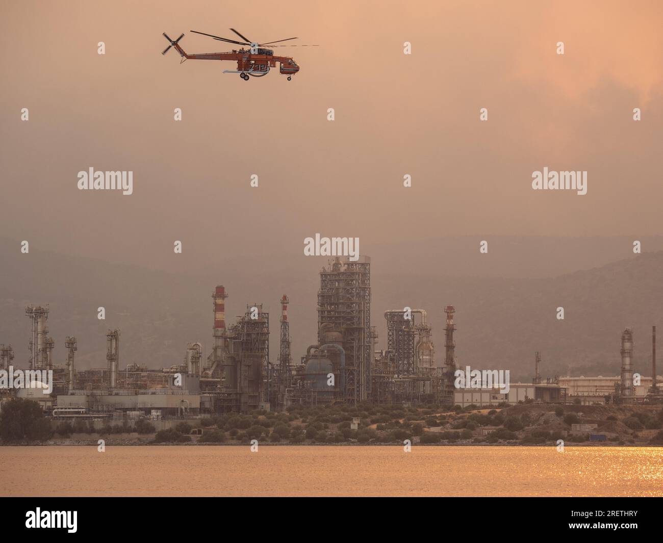 Elefsina, Greece 07.18.23: Firefighting helicopter flies over oil ...