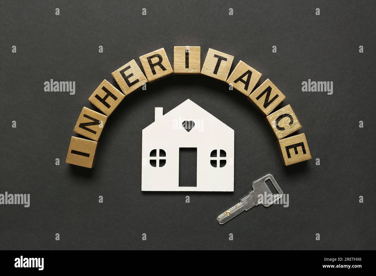 Word Inheritance made with cubes, house model and key on black ...