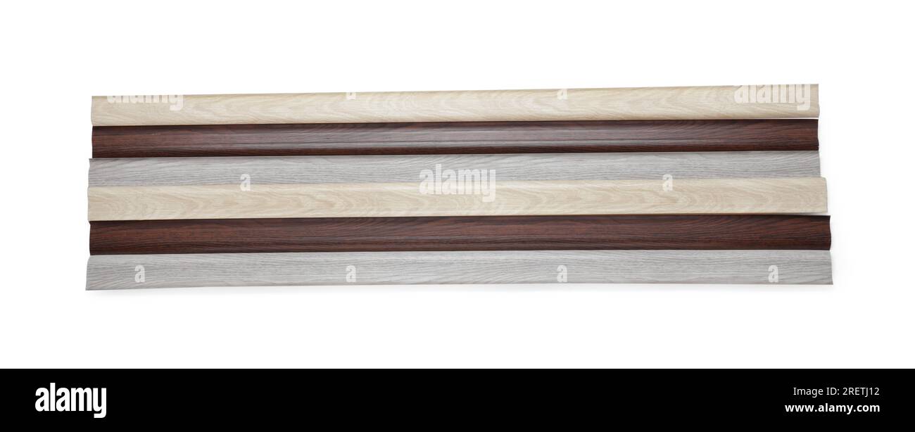Many pieces of wooden baseboards isolated on white, top view Stock ...