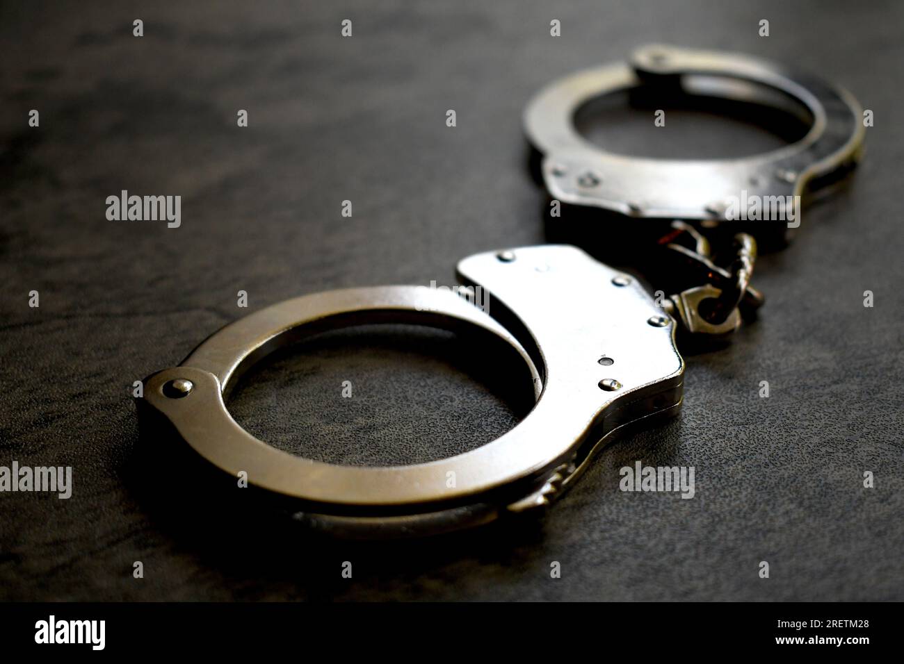 Arrested handcuffs hi-res stock photography and images - Alamy