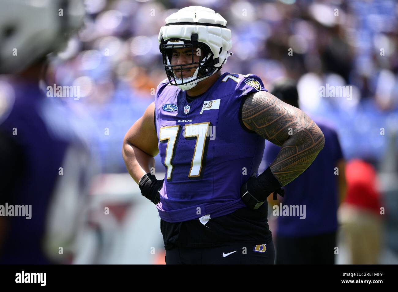 Baltimore Ravens offensive tackle Daniel Faalele (77) works out during ...