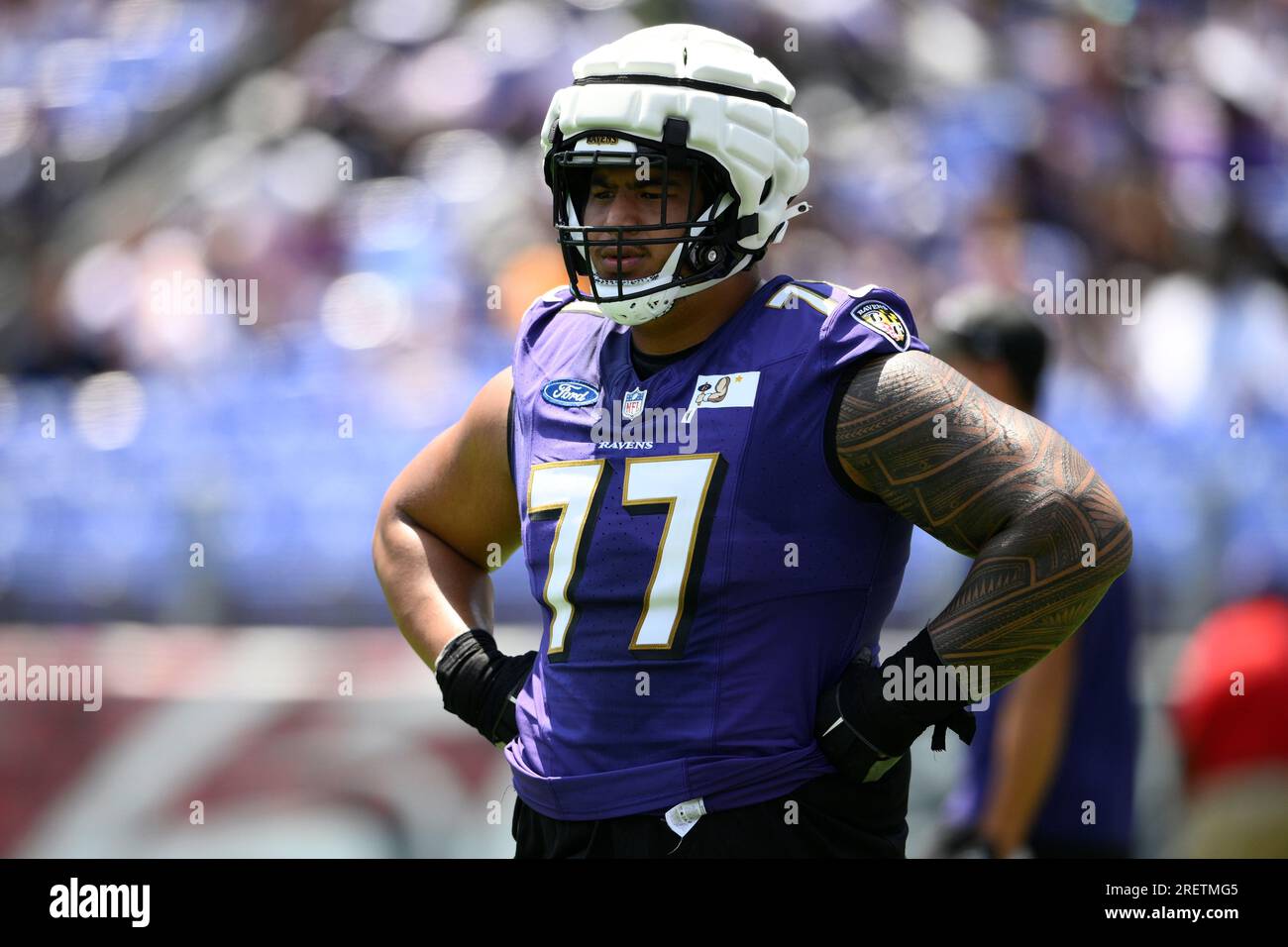 Baltimore Ravens offensive tackle Daniel Faalele (77) works out during ...