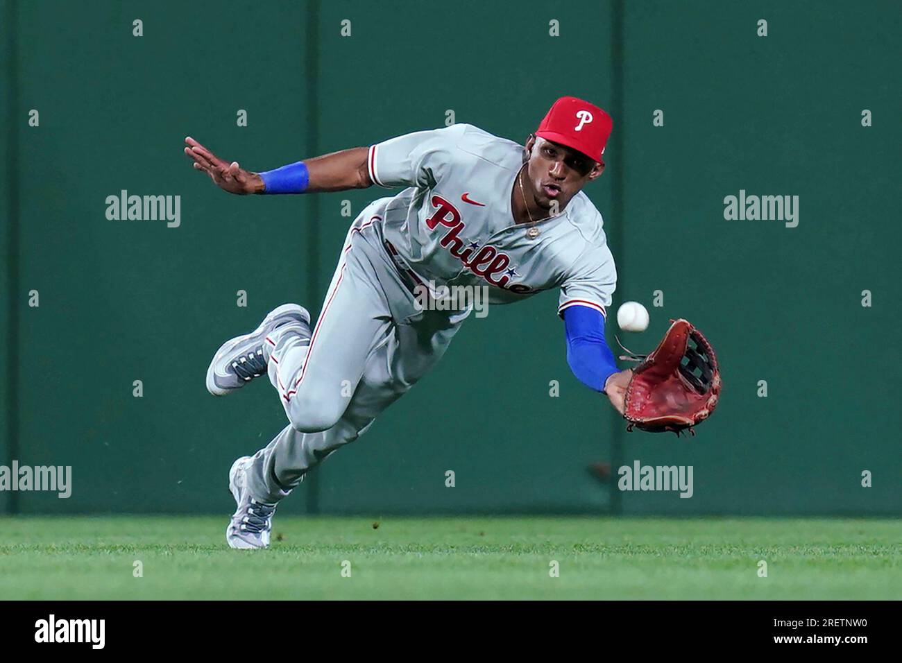 Philadelphia Phillies center fielder Johan Rojas dives to pull in a ...