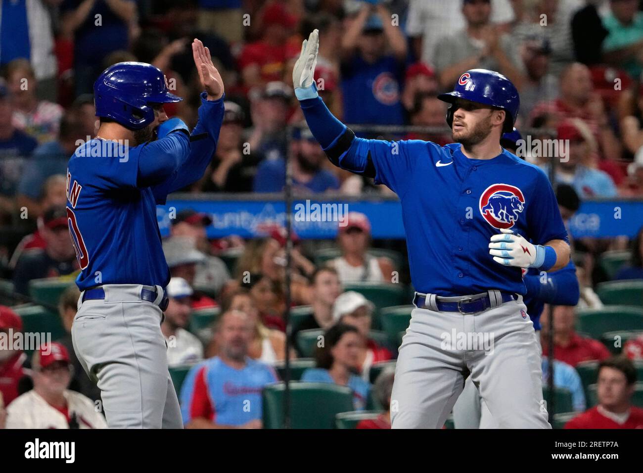 Chicago Cubs' Ian Happ, right, is congratulated by teammate Mike ...