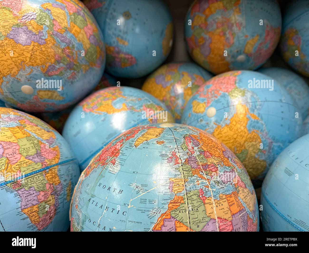 Background with multiple round globes in a pile. Selective focus Stock ...