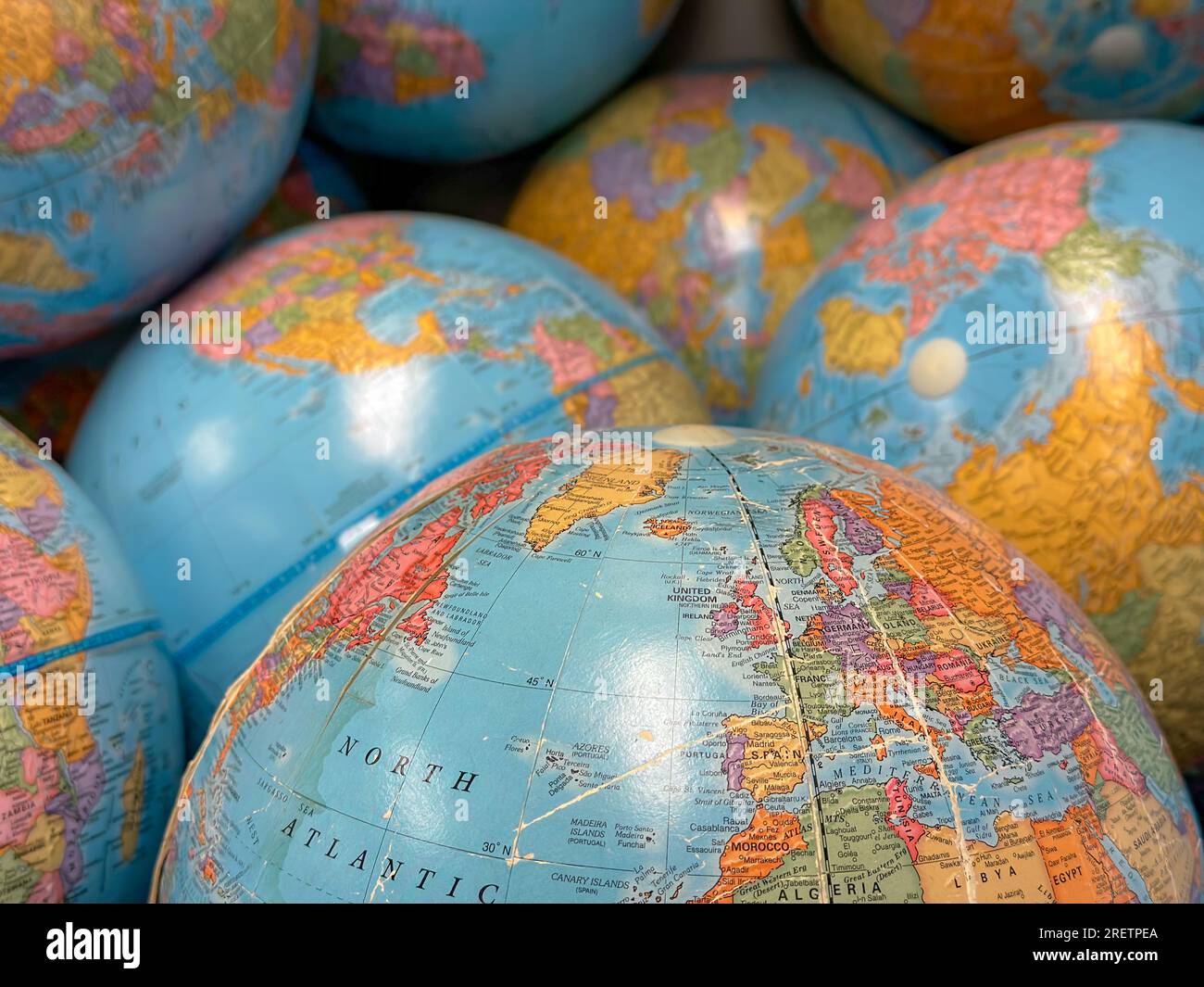 Background with multiple round globes in a pile. Selective focus Stock ...