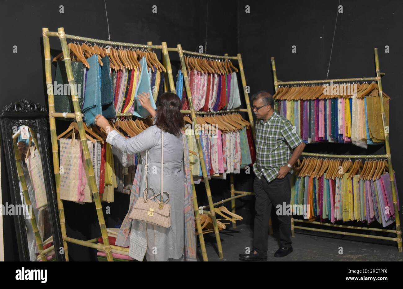 Dhaka. 30th July, 2023. Visitors look at Jamdani sarees (women's ...