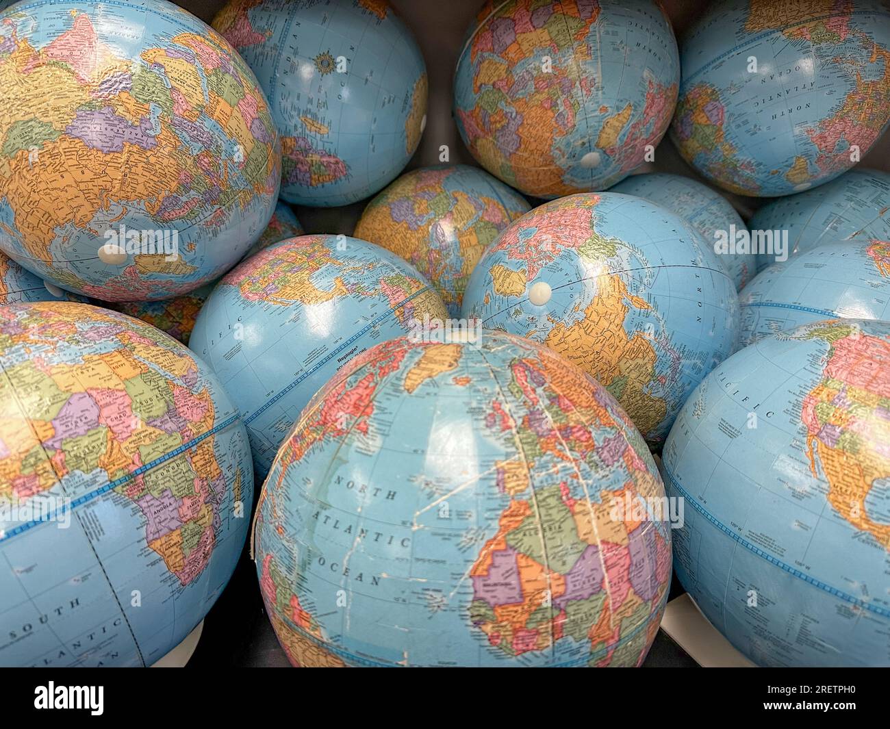 Background with multiple round globes in a pile. Selective focus Stock ...