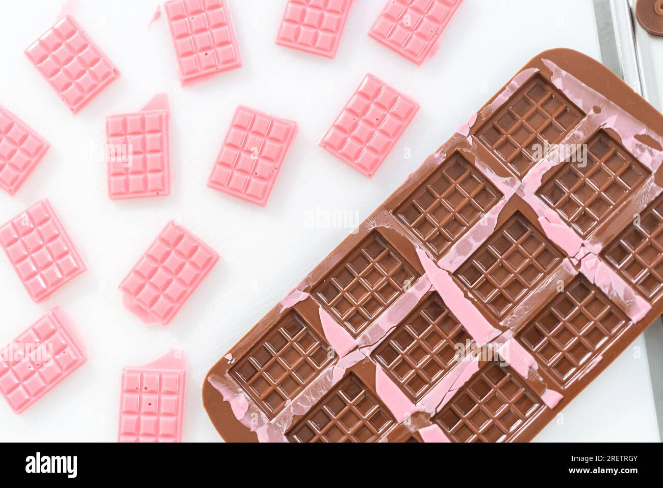 Mini pink chocolates Stock Photo - Alamy