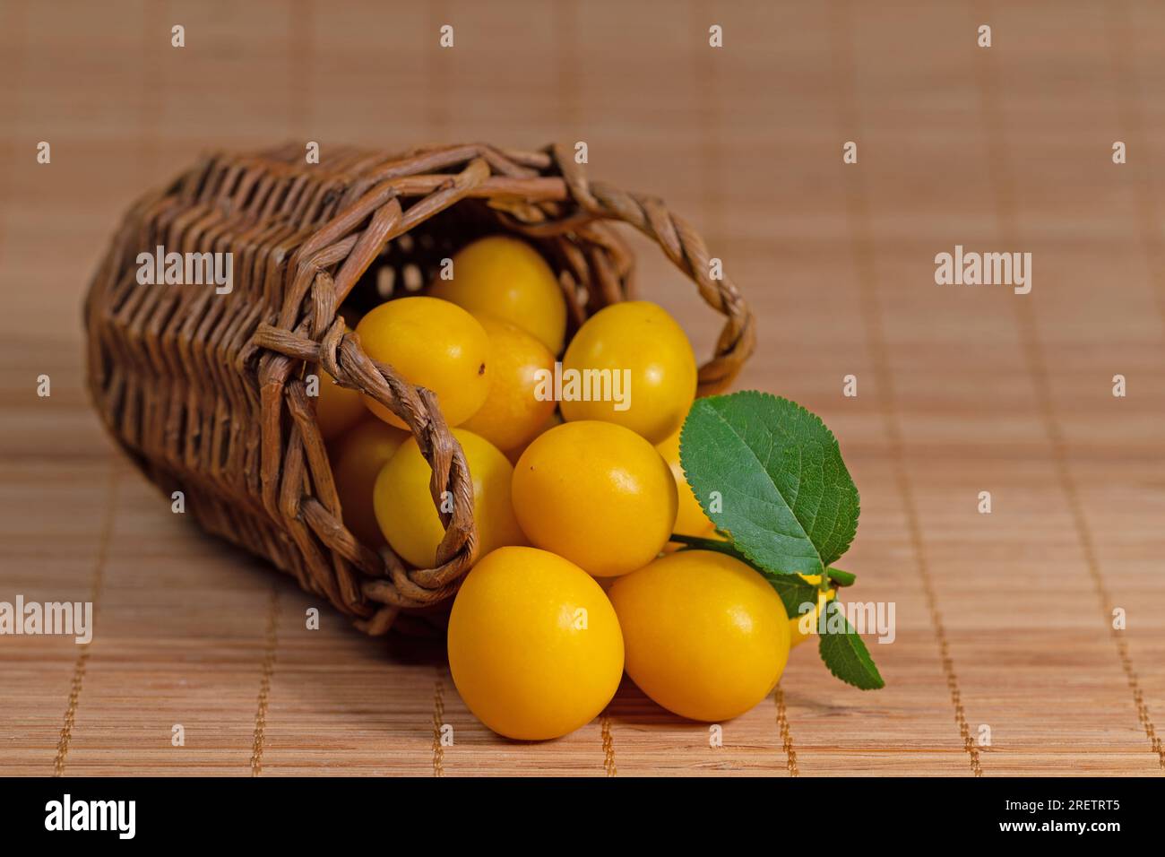 Yellow cherry plums, Prunus cerasifera, in basket Stock Photo - Alamy