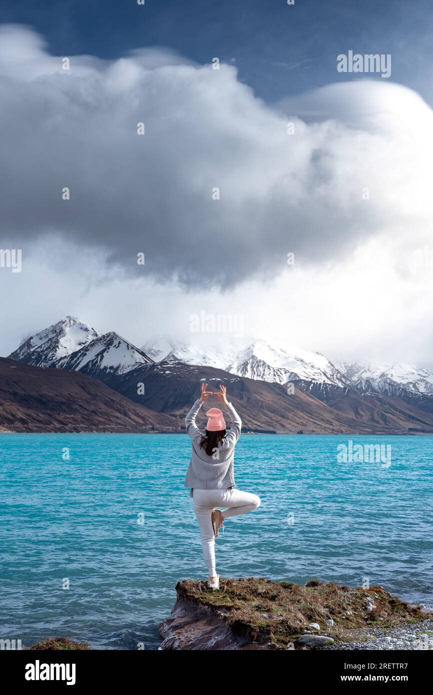 Asian female yogi practice yoga at the beautiful scenic sunrise view of ...