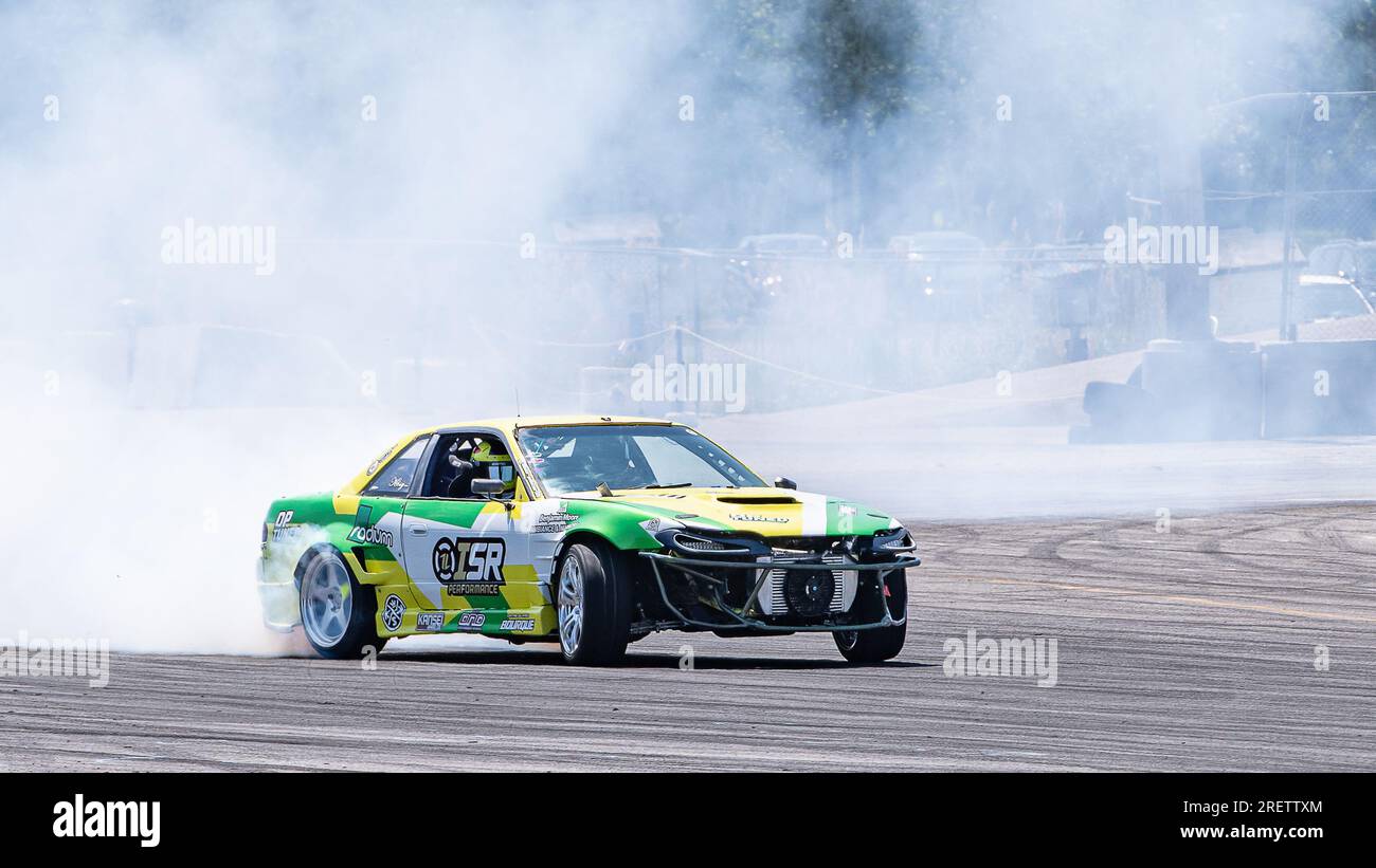 Car drifting auto racing event action with smoking tires - burning ...