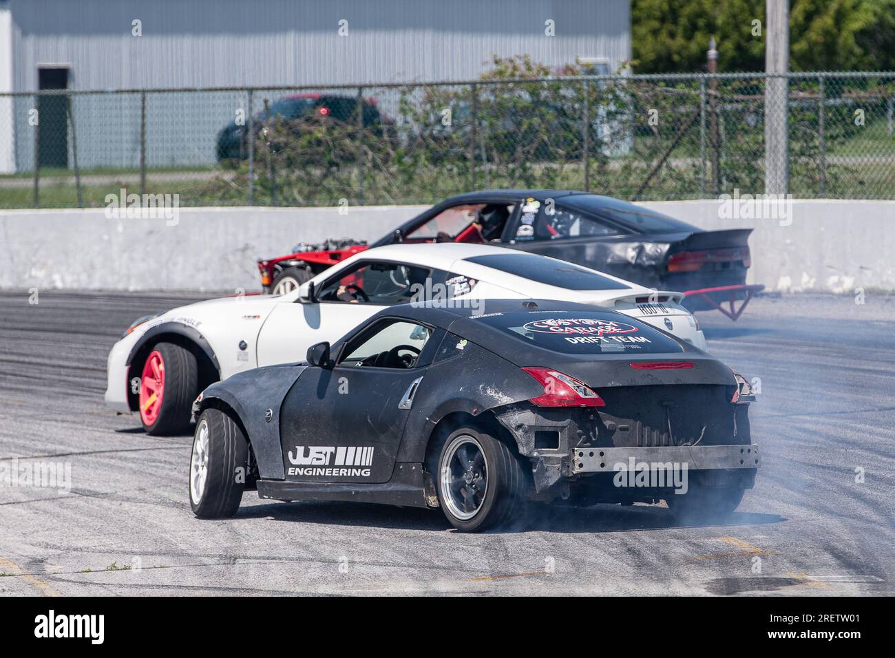 Car drifting auto racing event action with smoking tires - burning ...