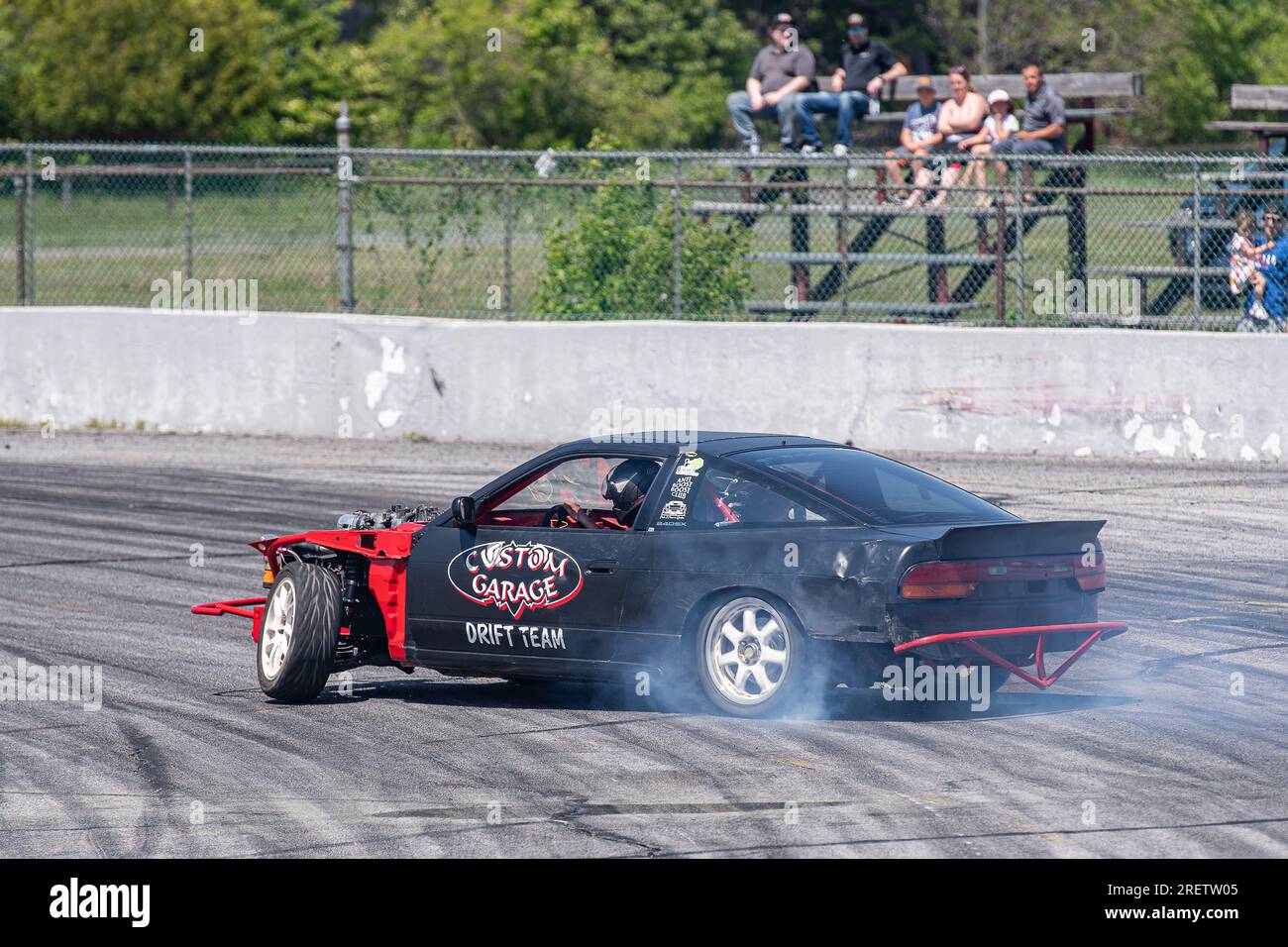 Car drifting auto racing event action with smoking tires - burning ...