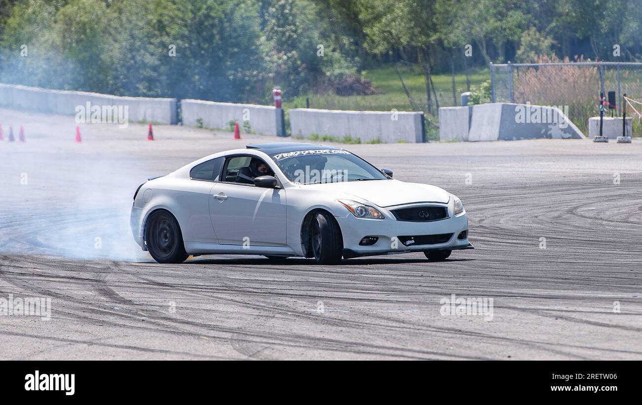 Car drifting auto racing event action with smoking tires - burning ...