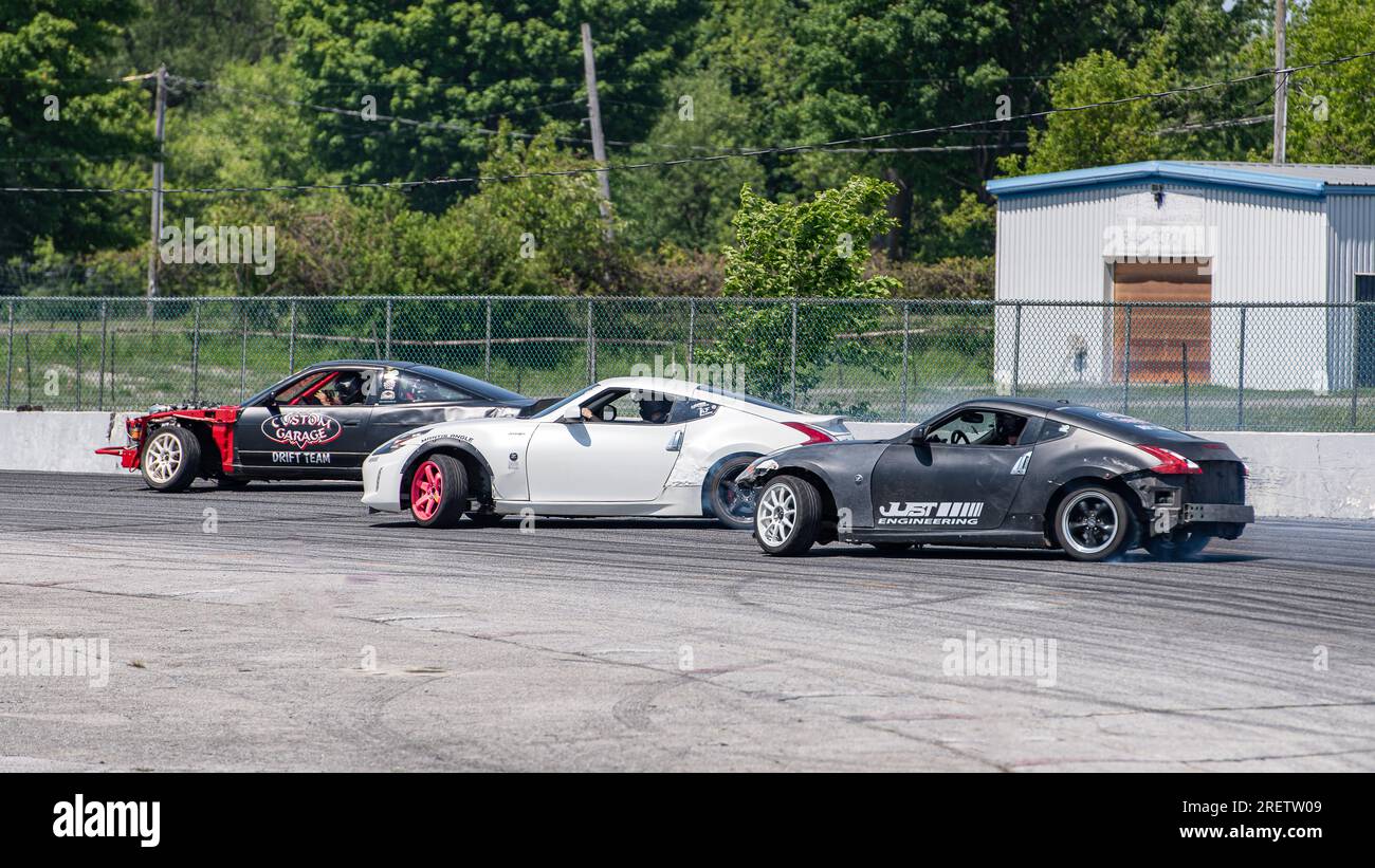 Car drifting auto racing event action with smoking tires - burning ...