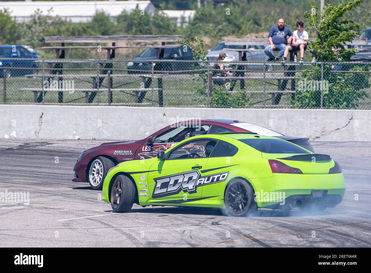 Car drifting auto racing event action with smoking tires - burning ...