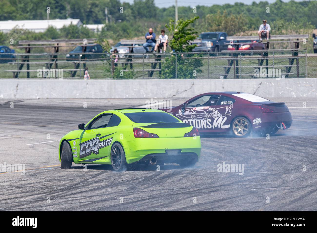Car drifting auto racing event action with smoking tires - burning ...