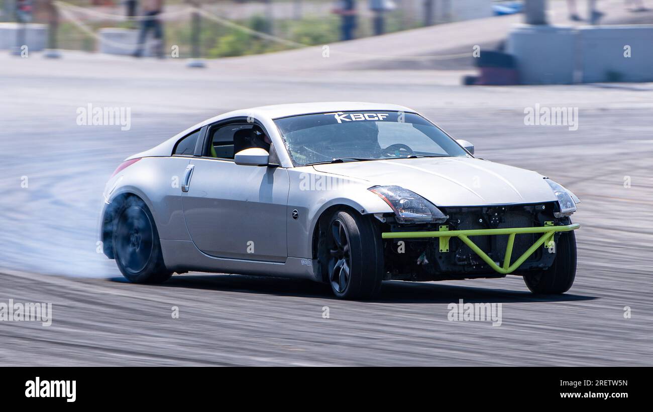 Car drifting auto racing event action with smoking tires - burning ...