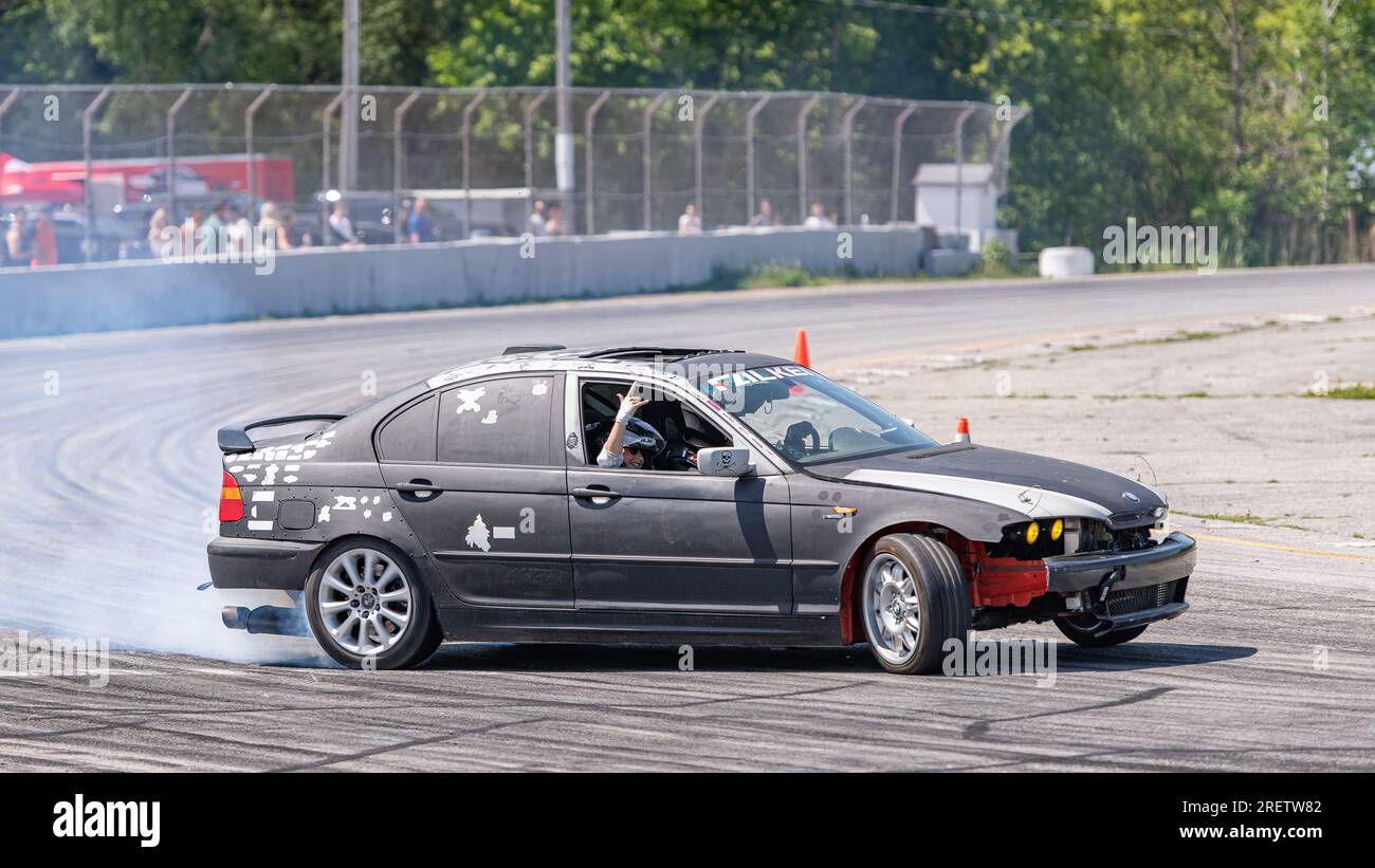 Car drifting auto racing event action with smoking tires - burning ...