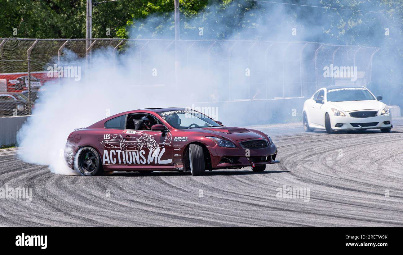 Car drifting auto racing event action with smoking tires - burning ...