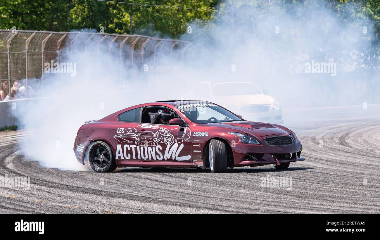 Car drifting auto racing event action with smoking tires - burning ...