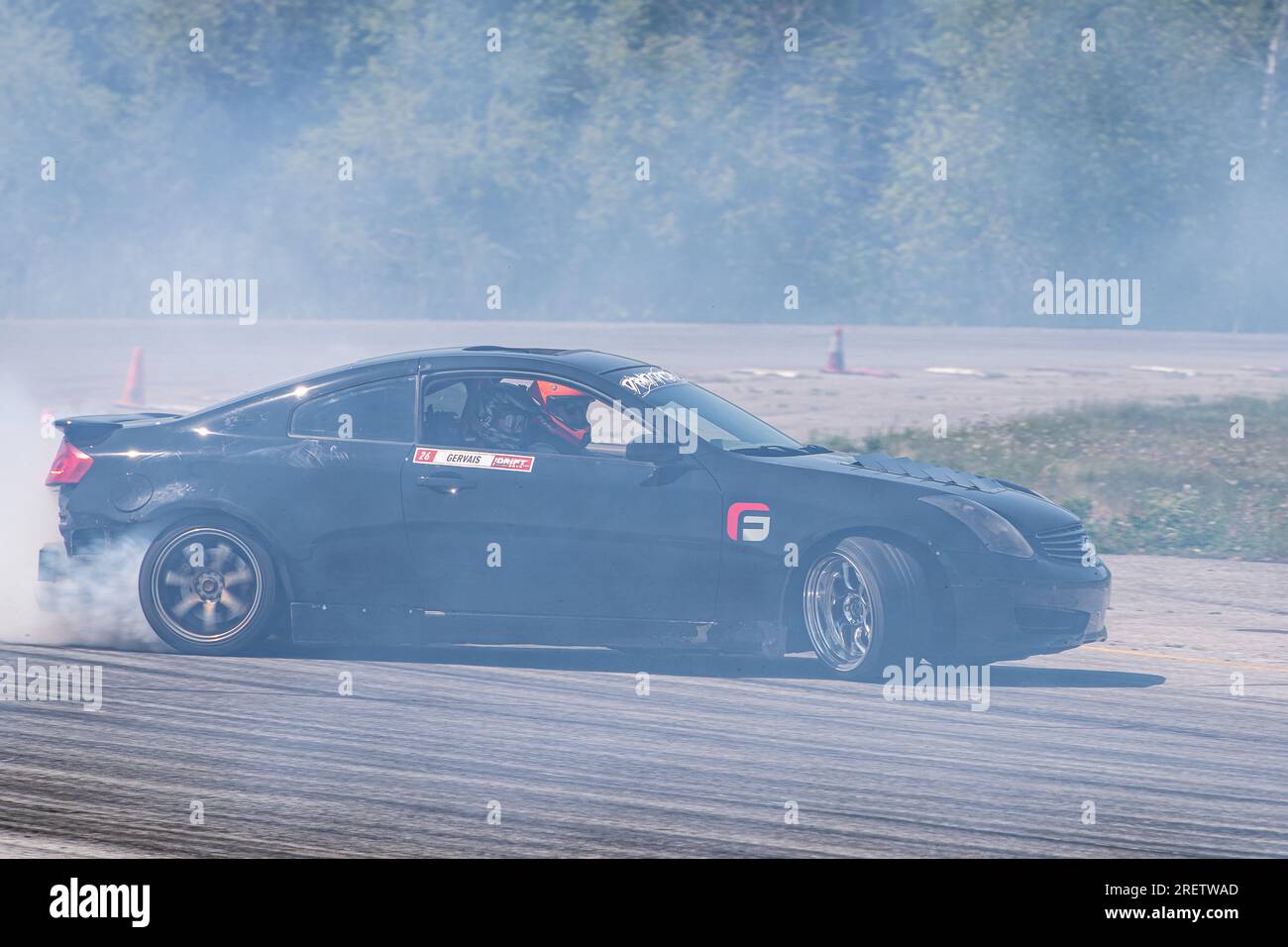 Car drifting auto racing event action with smoking tires - burning ...