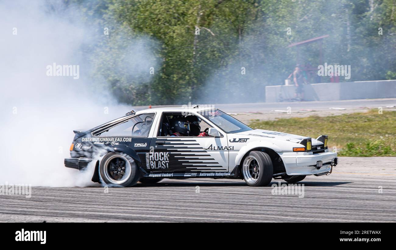 Car drifting auto racing event action with smoking tires - burning ...