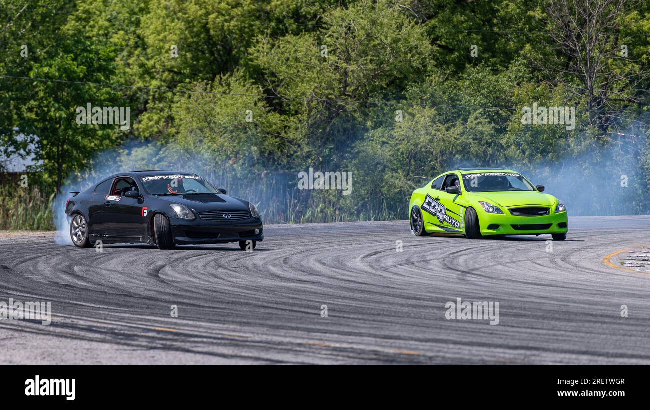 Car drifting auto racing event action with smoking tires - burning ...