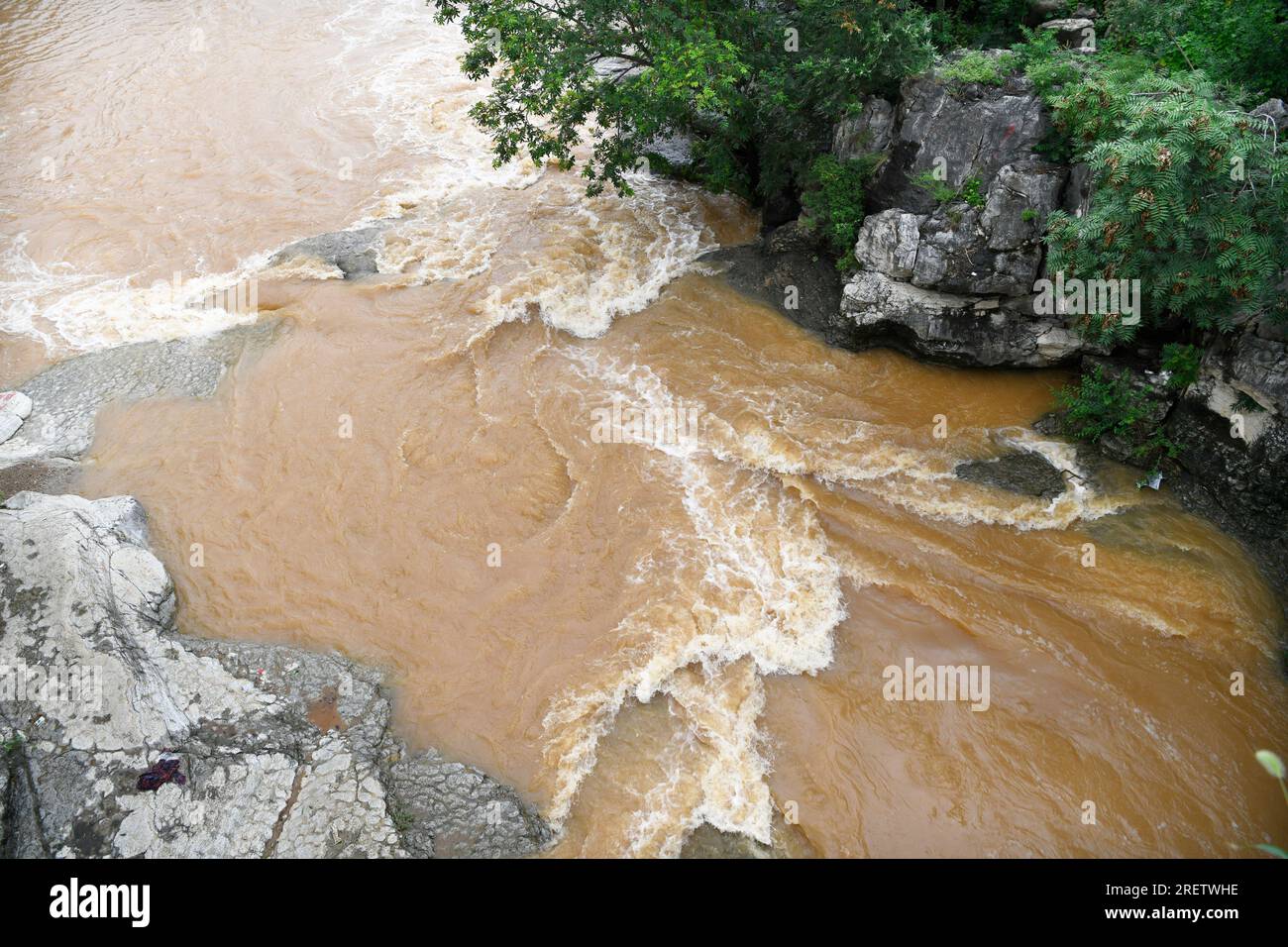 A flash flood caused by strong Typhoon "Super Typhoon Doksuri" is seen ...