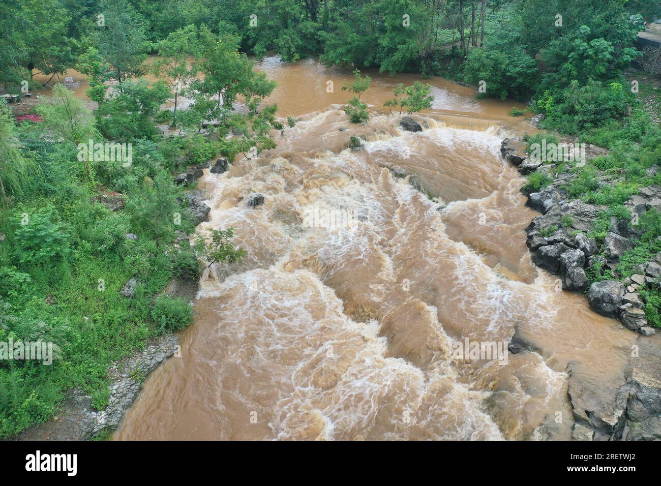 A flash flood caused by strong Typhoon "Super Typhoon Doksuri" is seen ...
