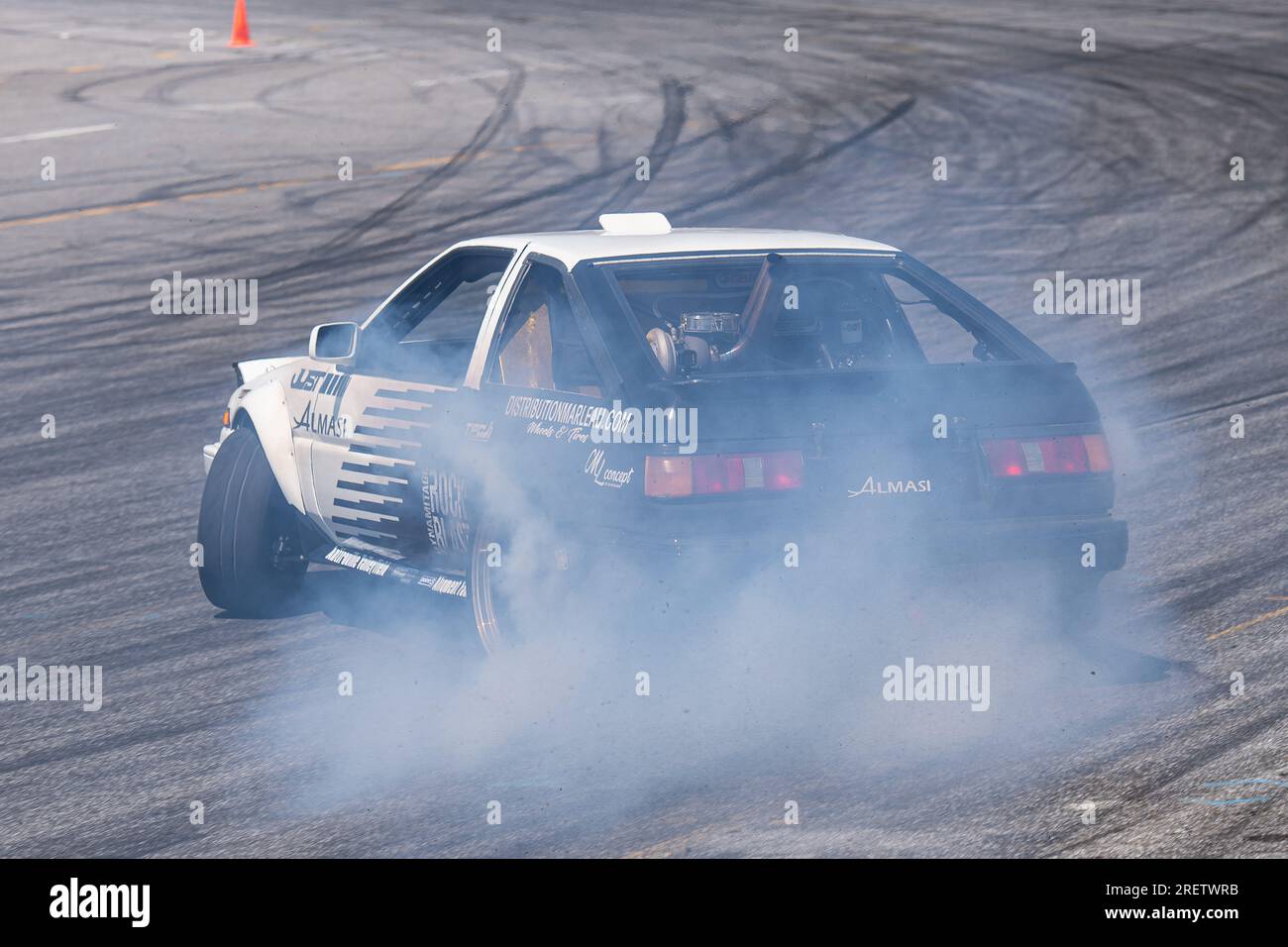 Car drifting auto racing event action with smoking tires - burning ...