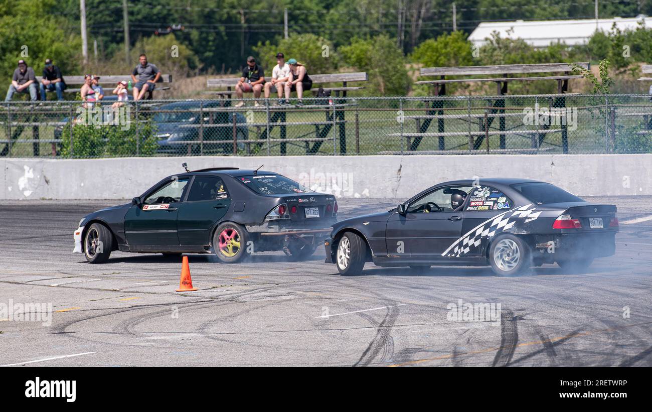 Car drifting auto racing event action with smoking tires - burning ...