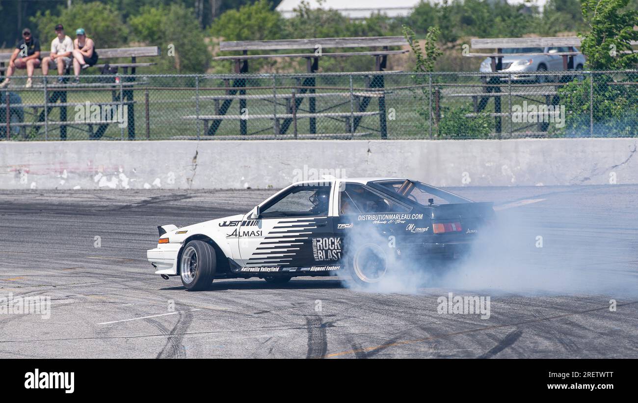Car drifting auto racing event action with smoking tires - burning ...