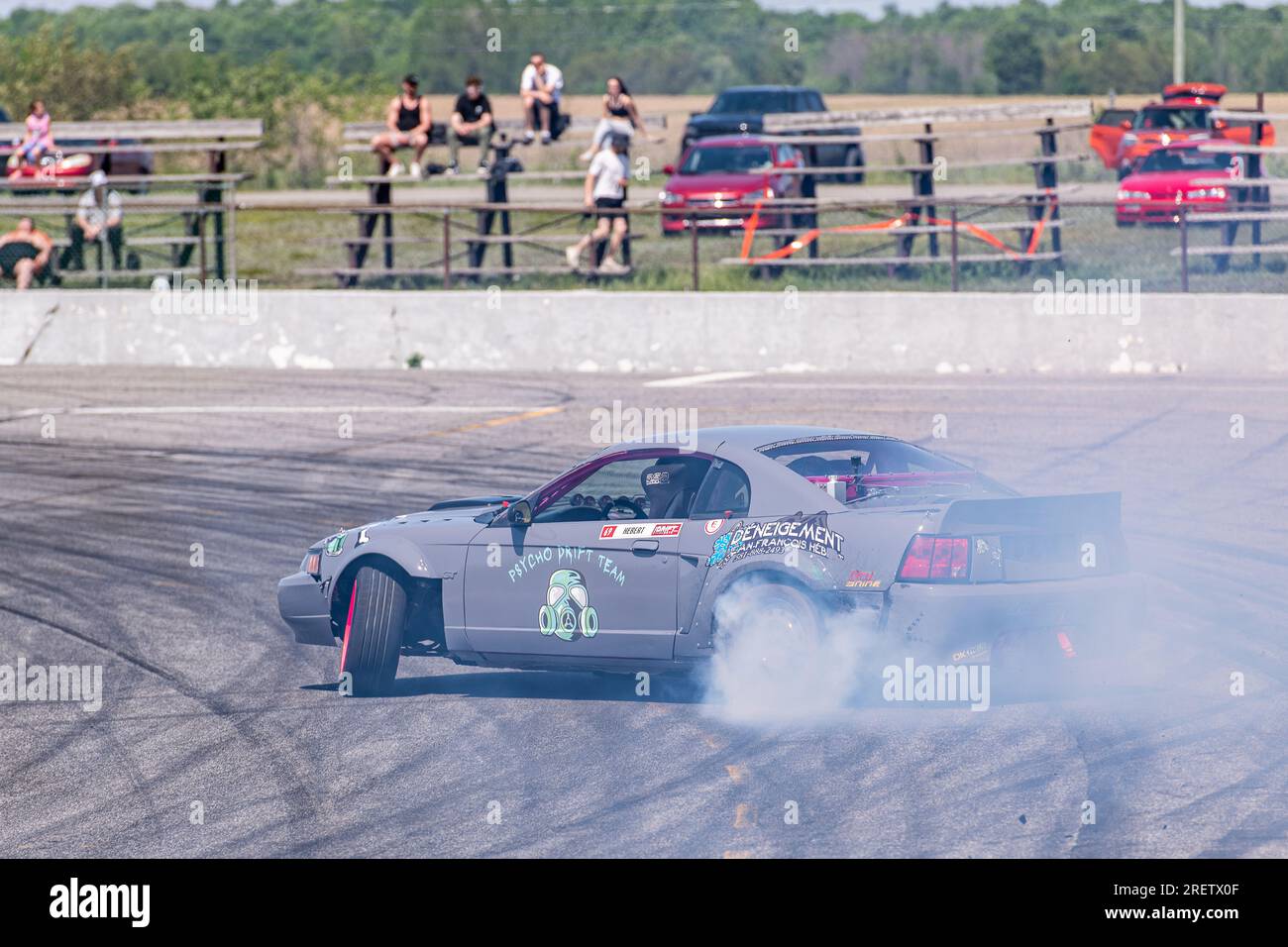Car drifting auto racing event action with smoking tires - burning ...