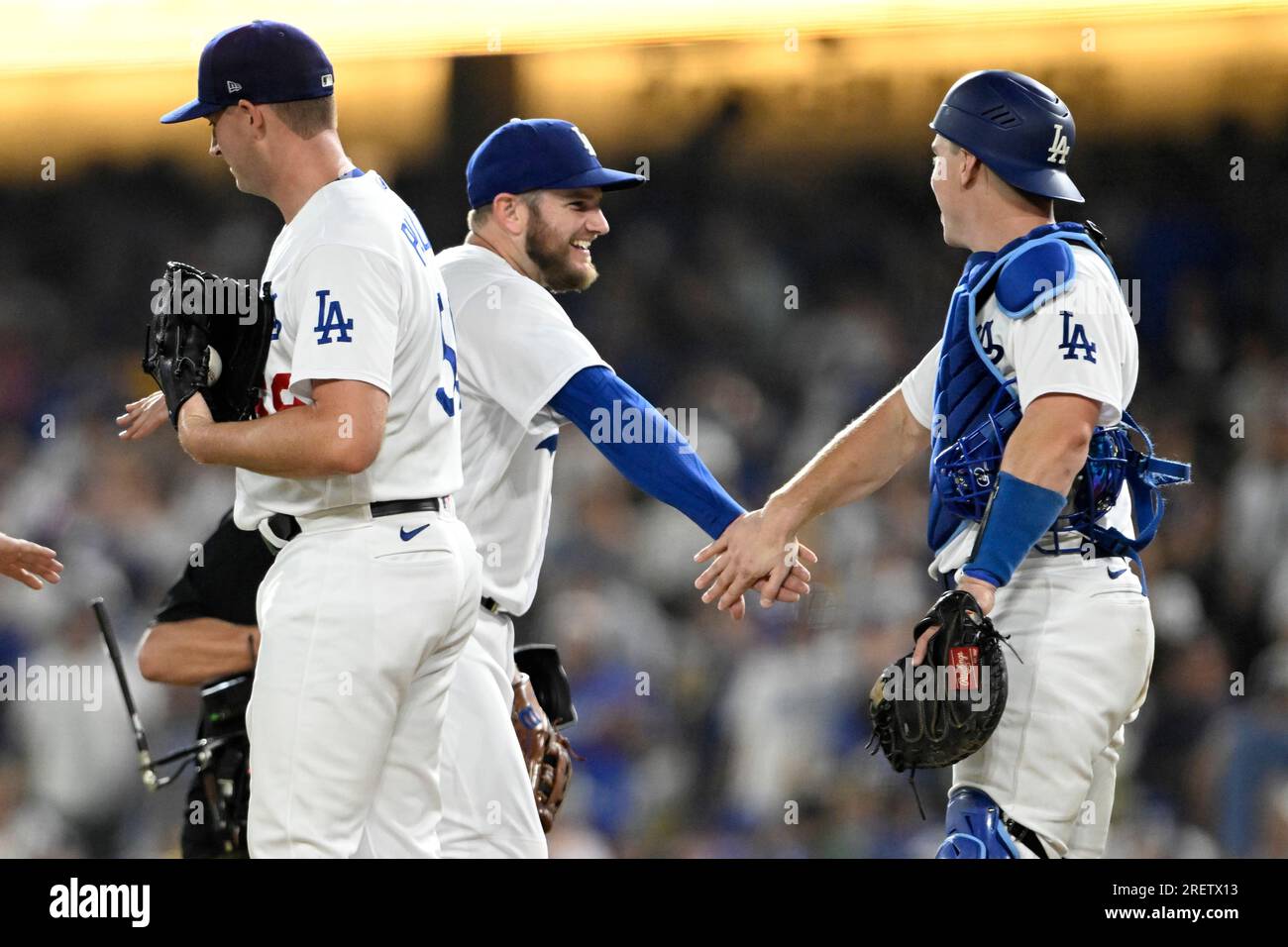 Los Angeles Dodgers third baseman Max Muncy, back, celebrates with ...