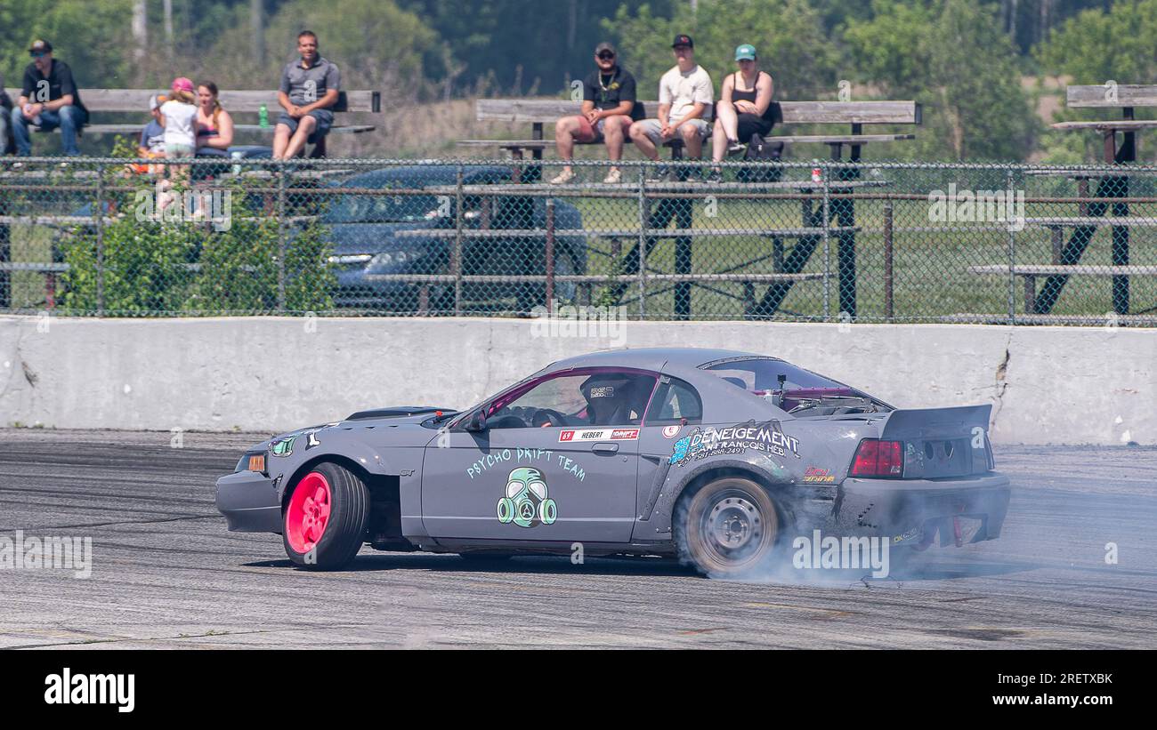 Car drifting auto racing event action with smoking tires - burning ...