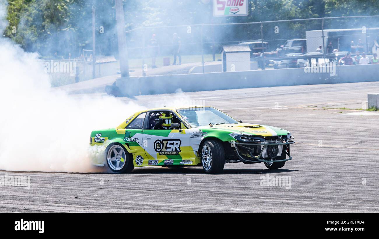 Car drifting auto racing event action with smoking tires - burning ...