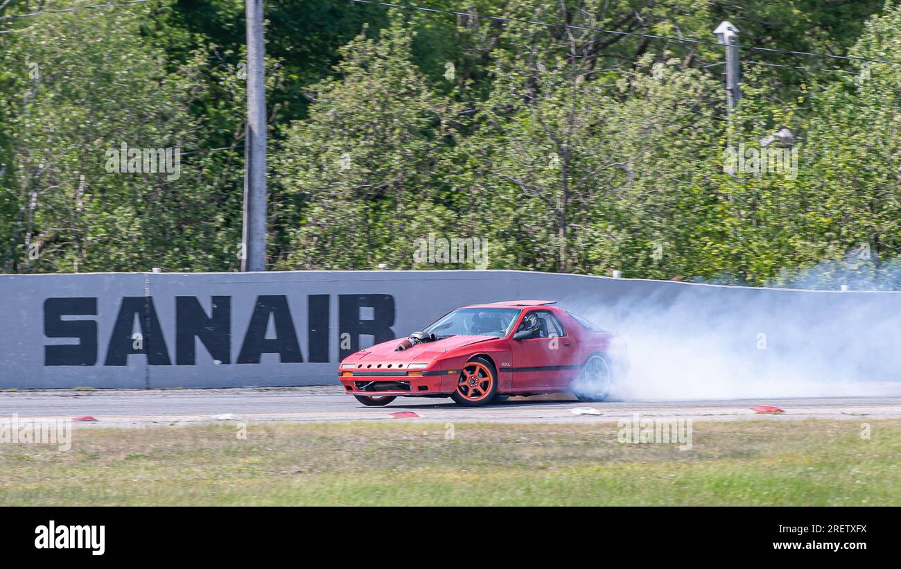 Car drifting auto racing event action with smoking tires - burning ...