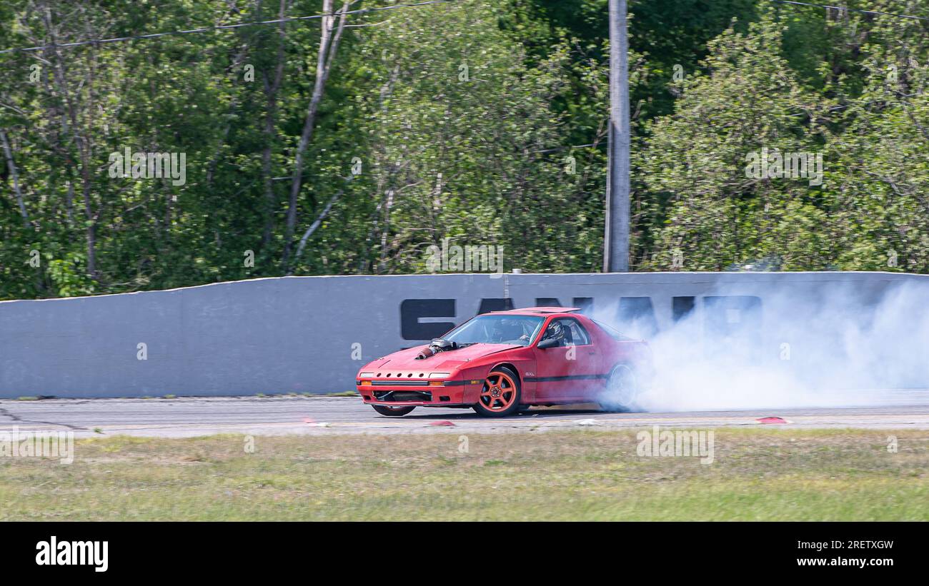 Car drifting auto racing event action with smoking tires - burning ...