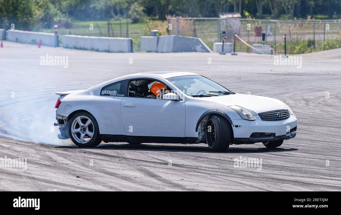 Car drifting auto racing event action with smoking tires - burning ...