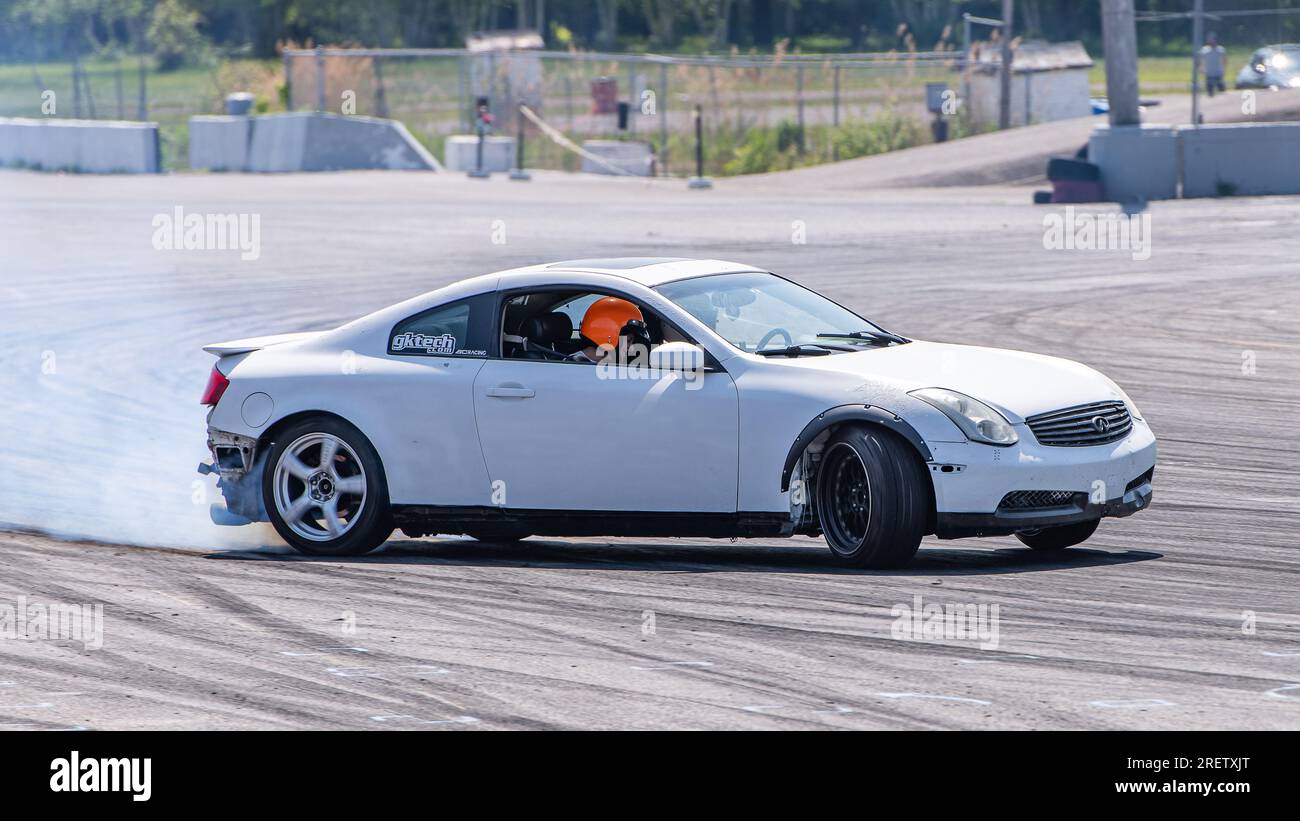 Car drifting auto racing event action with smoking tires - burning ...