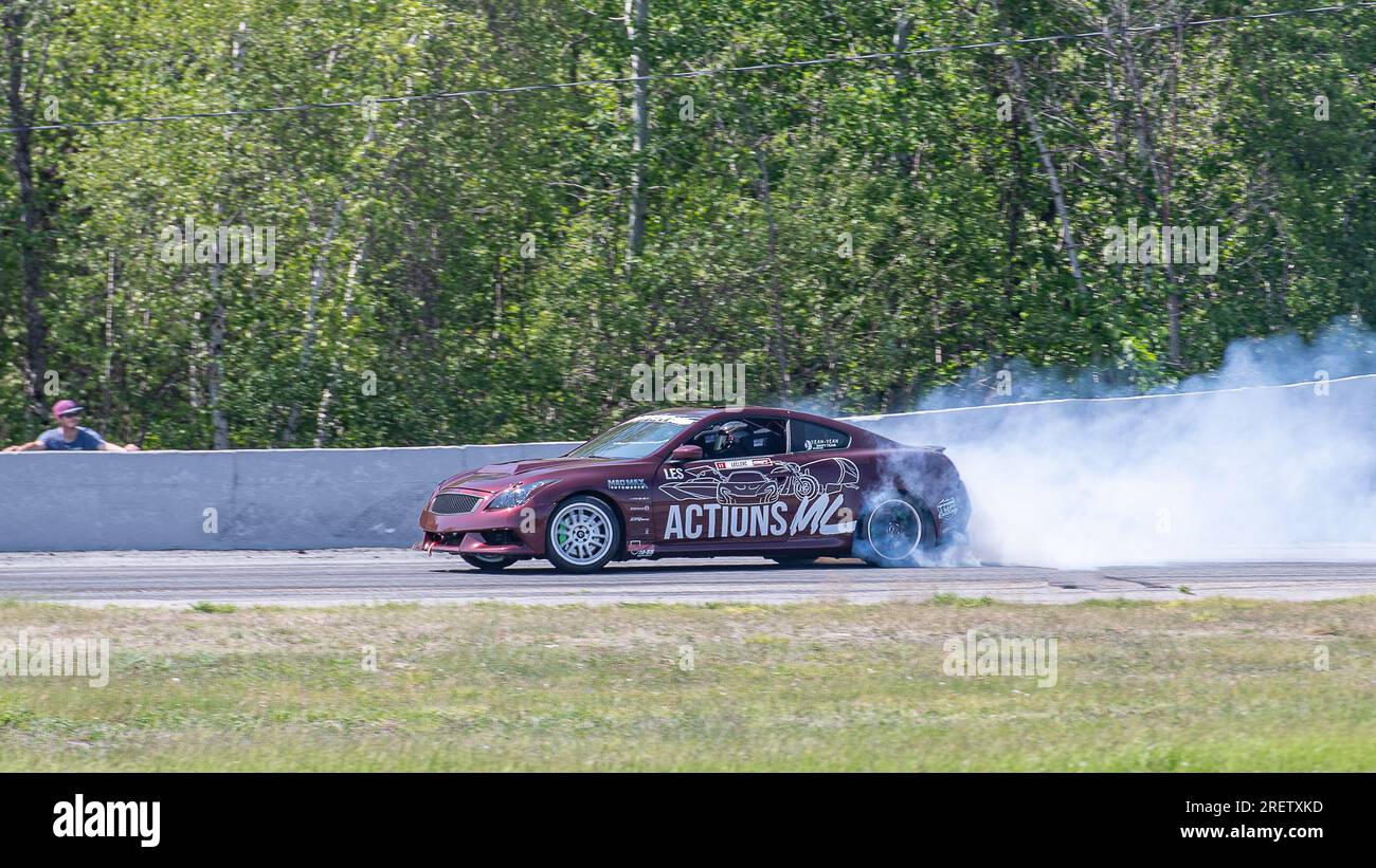 Car drifting auto racing event action with smoking tires - burning ...