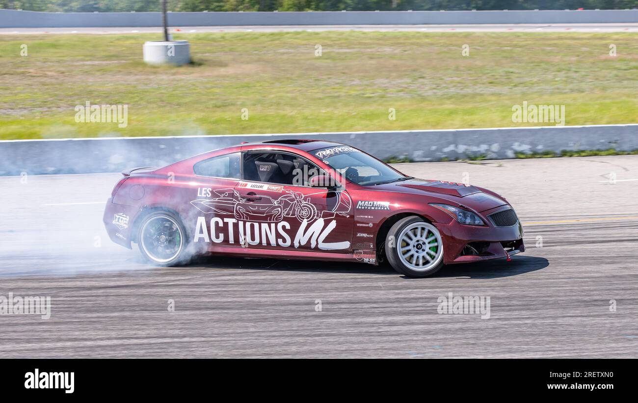 Car drifting auto racing event action with smoking tires - burning ...