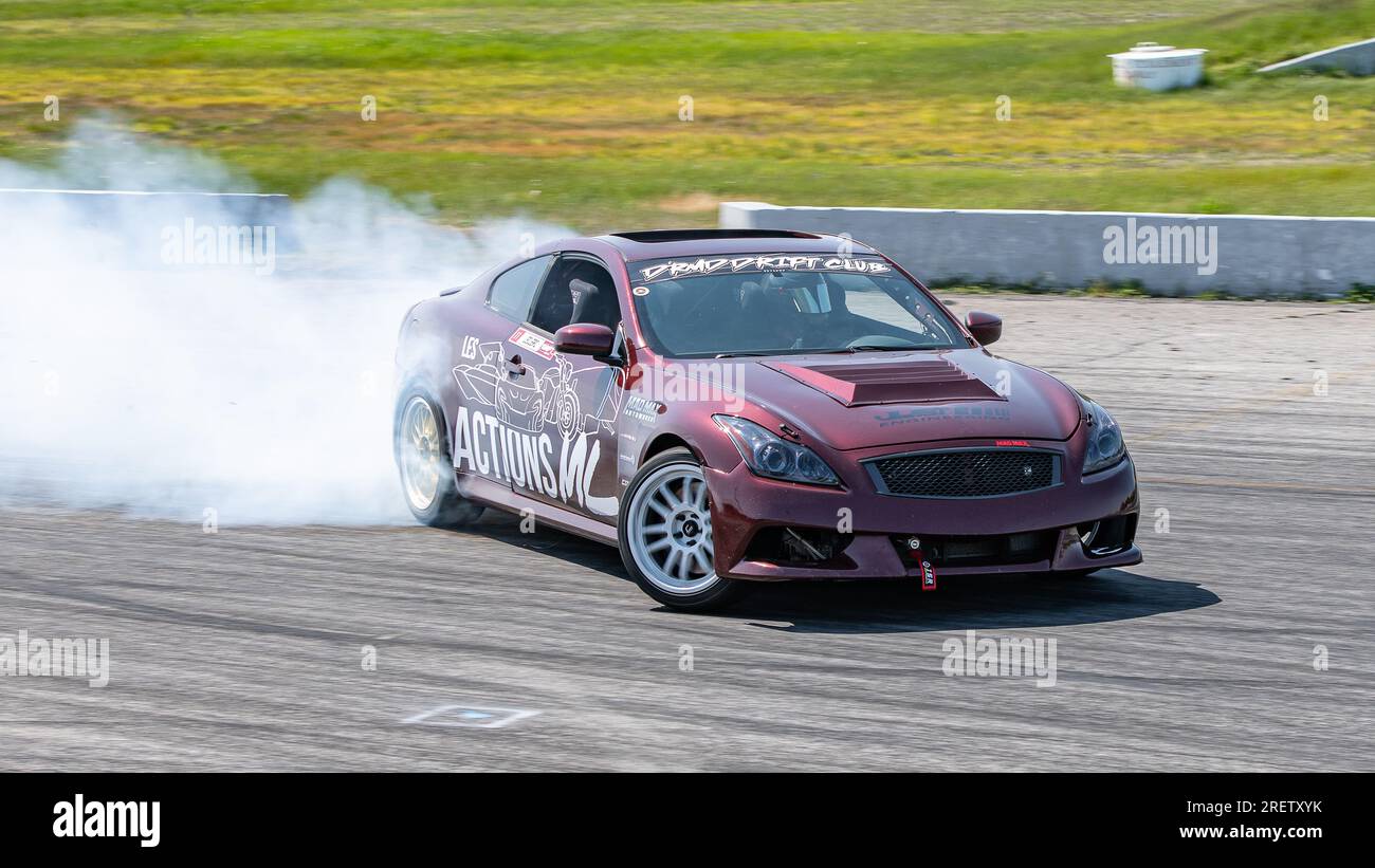Car drifting auto racing event action with smoking tires - burning ...