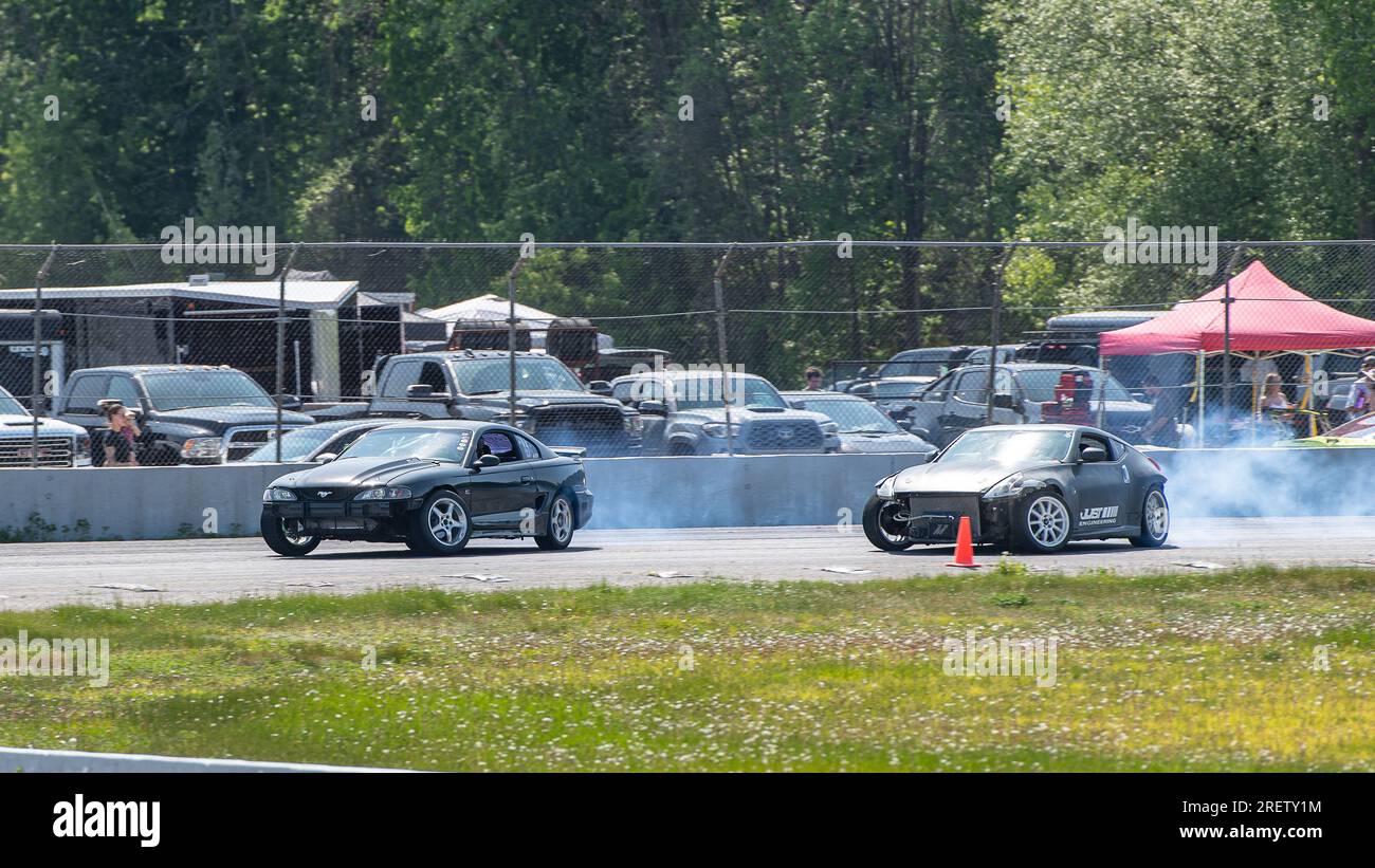 Car drifting auto racing event action with smoking tires - burning ...