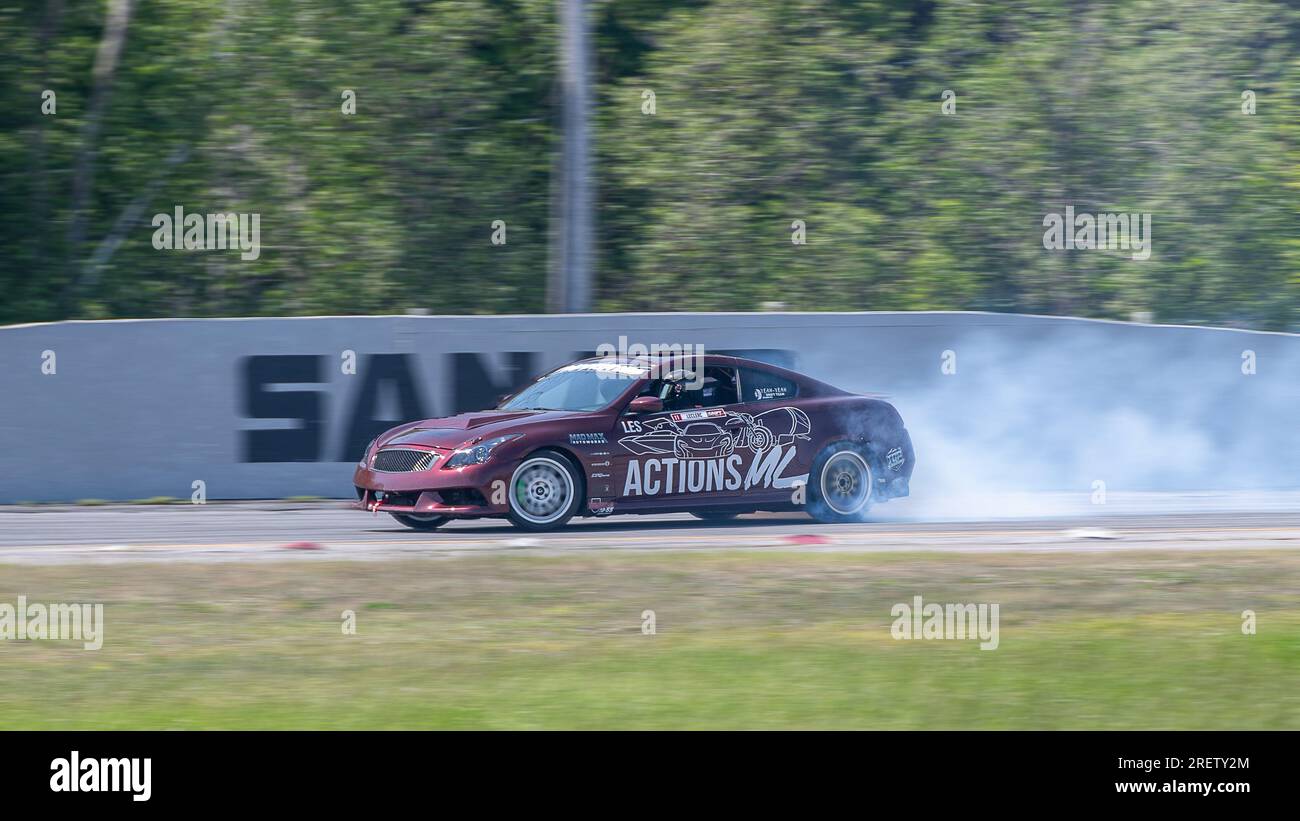 Car drifting auto racing event action with smoking tires - burning ...