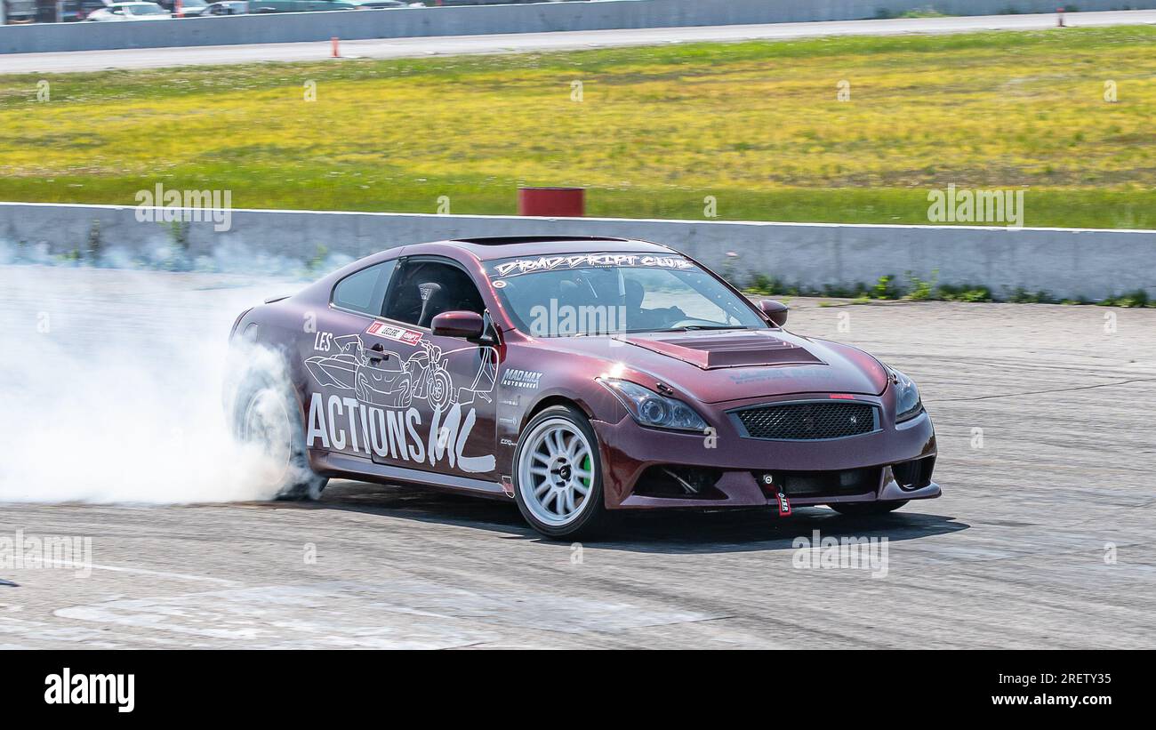 Car drifting auto racing event action with smoking tires - burning ...