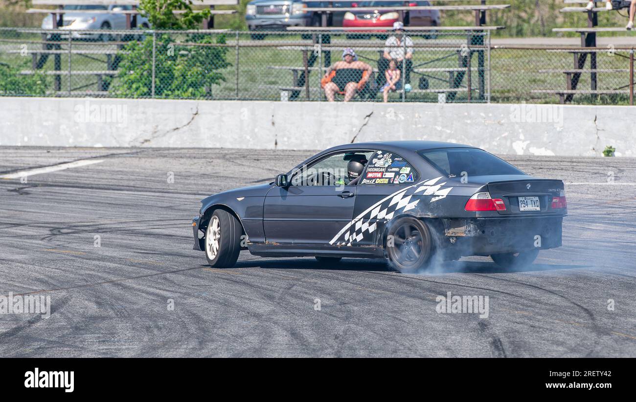 Car drifting auto racing event action with smoking tires - burning ...
